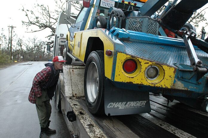 Tow Truck Driver FORCED TO FLEE After CROWD SURROUNDS Repo Vehicle ...
